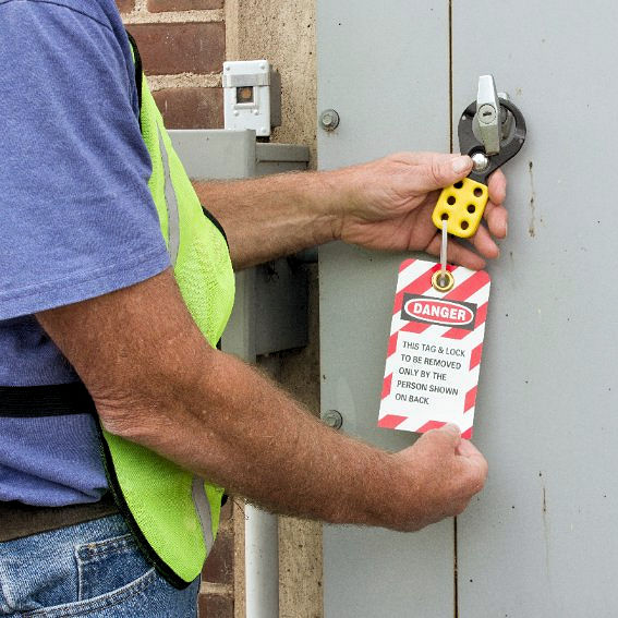 Worker installing a lockout device